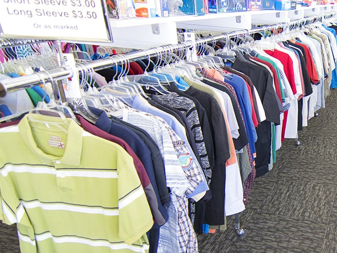 The men's shirt section: where Hawaiian prints that survived countless barbecues wait patiently for their next luau or casual Friday appearance.