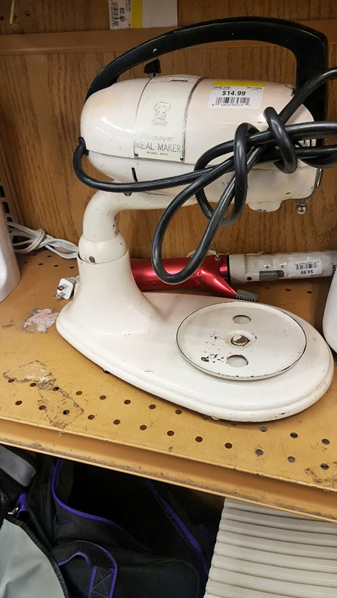 A vintage Meal Maker mixer stands sentinel, a relic from when kitchen appliances were built to outlast their owners.