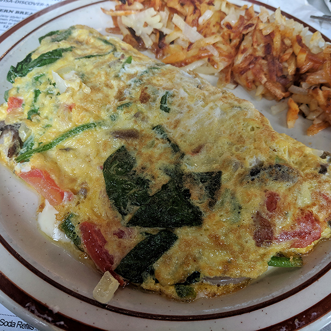 This veggie-packed omelet proves that healthy choices can still be indulgent, especially when paired with those addictively crispy hash browns.