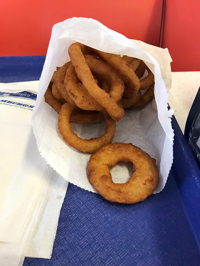 Onion rings so perfectly golden they deserve their own trophy. The satisfying crunch is just the beginning of this flavor journey.