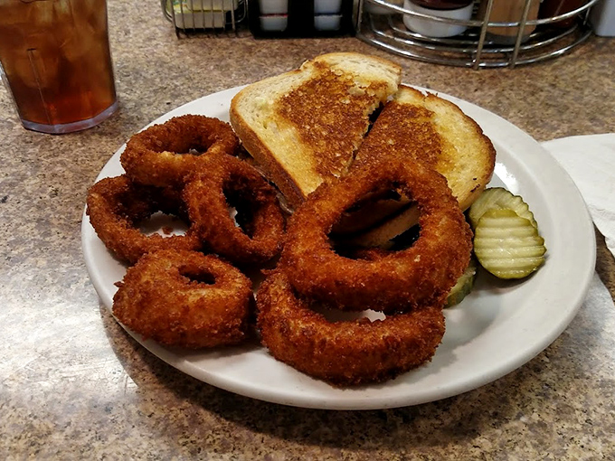 Onion rings with the perfect crunch-to-tenderness ratio, proving that sometimes the simplest pleasures are the most satisfying.