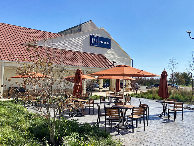 Outdoor seating by Gap Factory lets weary shoppers rest between retail victories and strategic store planning.