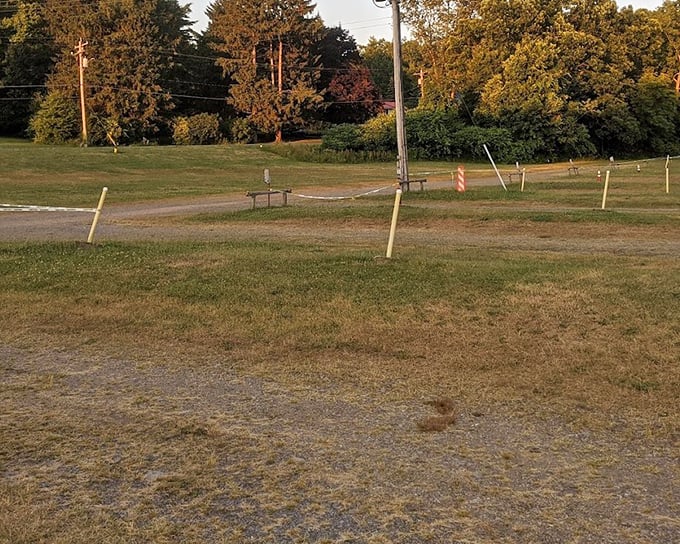 The golden hour at Midway Drive-In paints everything in amber light, transforming an ordinary field into a gathering place for memory-making under open skies.