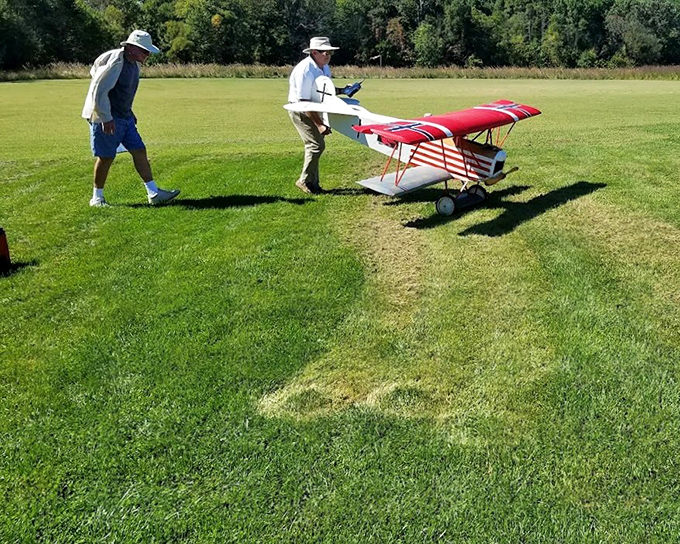 Weekend aviators prepare for takeoff, proving you're never too old to enjoy the thrill of flight, even if it's by remote control.