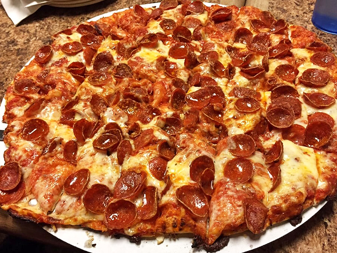 The pepperoni pizza at Tommy's features those perfect little cups that collect flavor treasures. Pizza engineering at its finest.