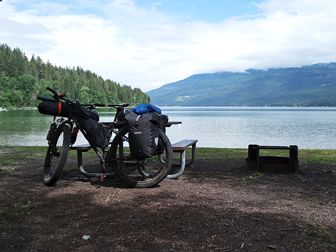 The ultimate picnic spot where your sandwich tastes Michelin-starred. That mountain backdrop makes everything more delicious.