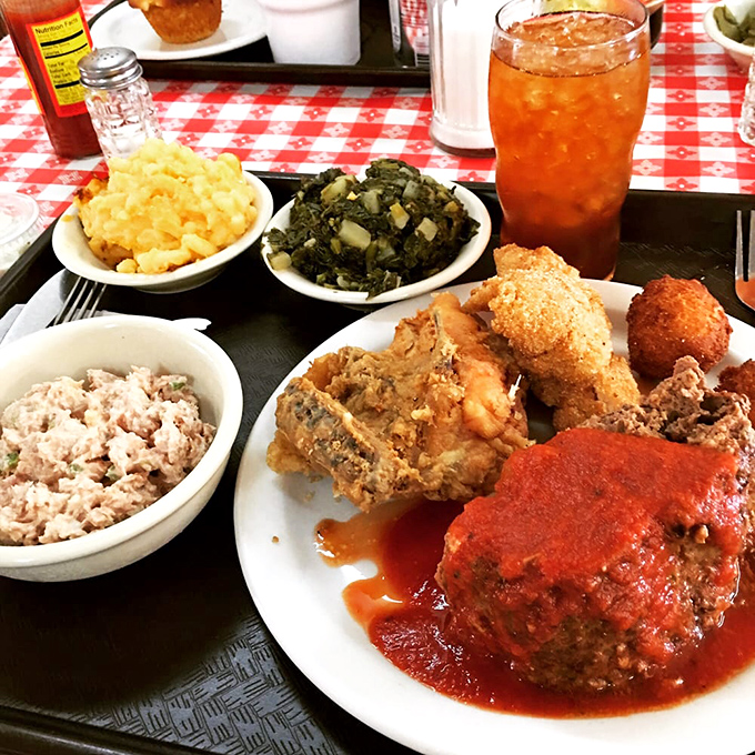 This plate whispers sweet Southern nothings: fried chicken, mac and cheese, greens, and enough comfort to cure whatever ails you.