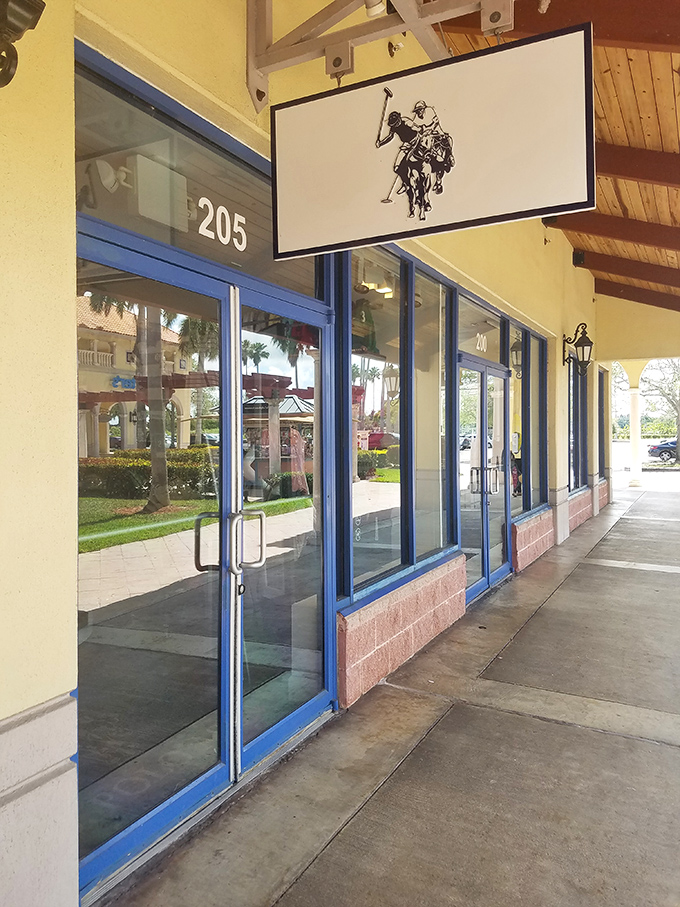 The polo player gallops above shoppers' heads, signaling that preppy paradise awaits inside without the country club membership fees.