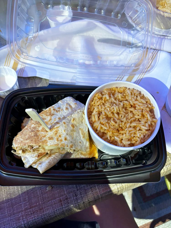 Quesadillas to go? Even in takeout form, the golden-brown tortilla and side of Mexican rice promise comfort that travels well.