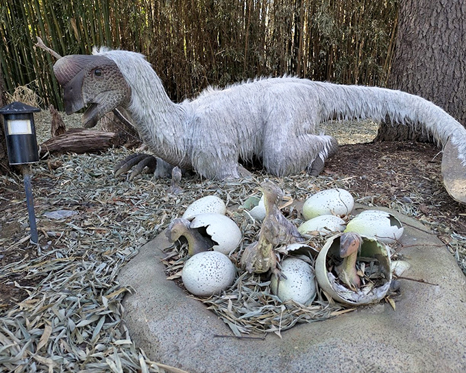 Dinosaur parenthood in action. This model of a raptor with hatching eggs offers a glimpse into prehistoric family life, complete with the kind of mess that transcends evolutionary timelines.