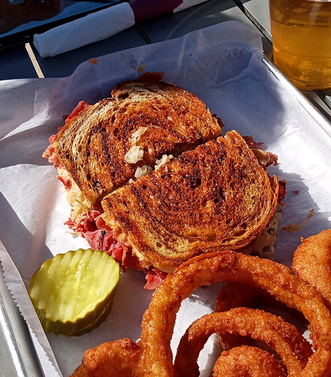 A Reuben sandwich that achieves the golden trifecta: perfectly toasted bread, generous filling, and that satisfying crunch when you bite into it.