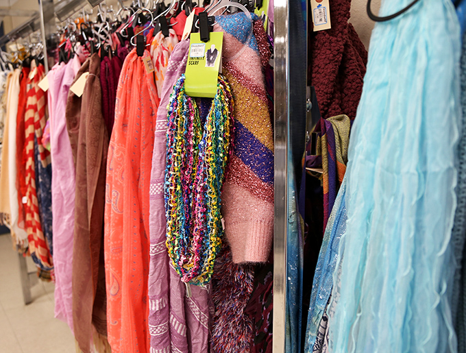 A rainbow of scarves and accessories that would make any fashionista swoon. Each colorful strand tells a story and awaits its next chapter.