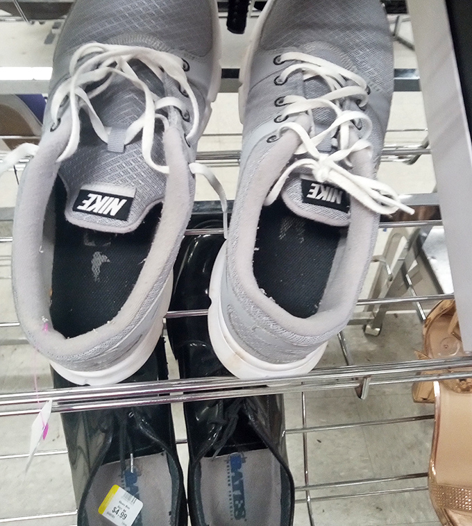 Gently worn Nikes awaiting their next marathon, or more likely, a casual stroll through the neighborhood. Athletic footwear reincarnation!