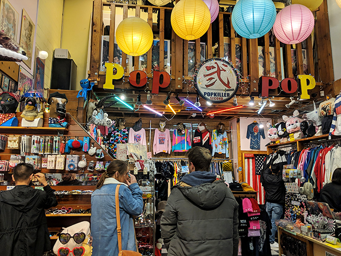 Beneath colorful paper lanterns and vintage signage, treasure hunters search for their next great find. The thrill of discovery hangs in the air.