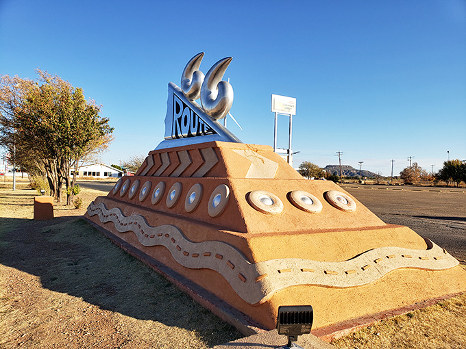 The monument's distinctive profile stands out against autumn skies, its swooping curves visible from blocks away.