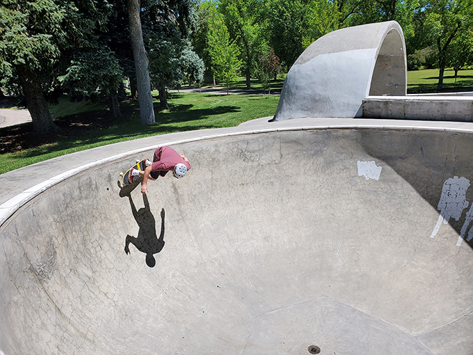 This skatepark bowl isn't just for the young—it's where retirees can reminisce about their rebel days while safely keeping both feet on the observation deck.