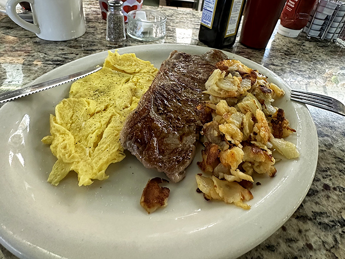 The classic steak and eggs&mdash;when you need protein that means business. Those home fries aren't just a side dish; they're a supporting actor worthy of an Oscar.