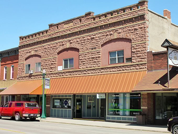 Buildings wearing their quartzite heritage like badges of honor, each storefront telling its own South Dakota story. 