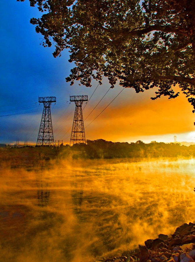 Sunrise paints the Susquehanna in impossible golds. Even the power lines can't help but join nature's most spectacular light show.