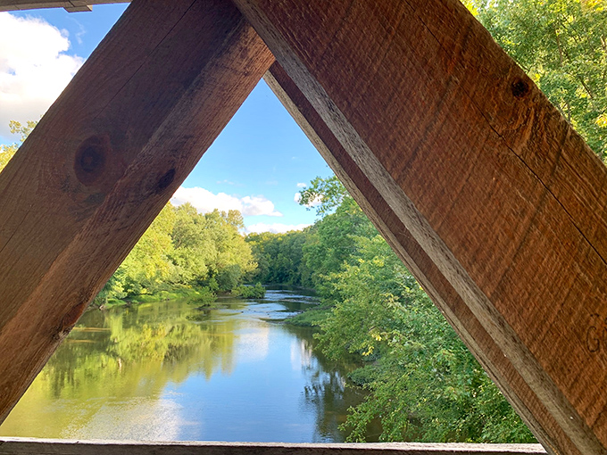 Nature framed perfectly&mdash;the river view through the bridge's wooden beams creates a living landscape painting worth the drive to Austinburg. 