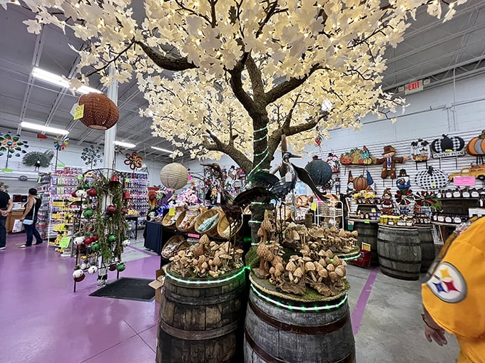 Nature meets whimsy under this illuminated tree display, where rustic barrels cradle treasures beneath branches that never need watering.