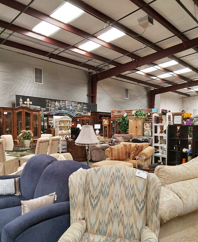 A sea of sofas and chairs arranged with surprising precision. It's like a furniture showroom where everything comes with a story.