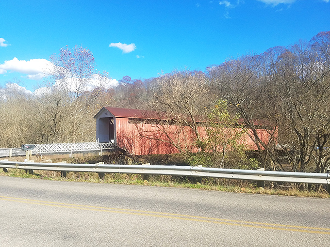 Viewed from the side, the bridge's profile reveals its elegant simplicity—architectural poetry written in wood and painted in that signature red.