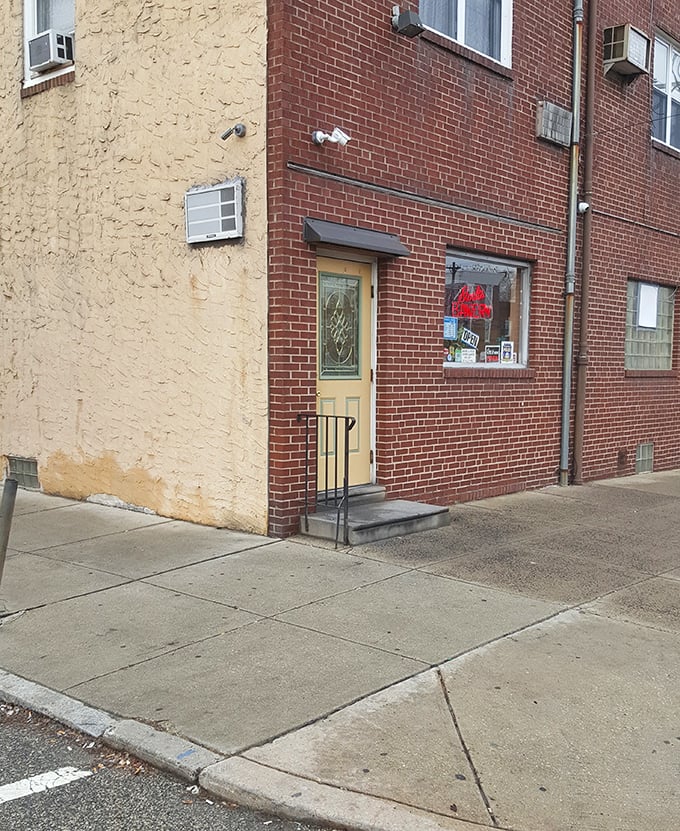 The yellow door and red neon sign &ndash; a beacon of hope for the butter-starved masses of Port Richmond since long before GPS.