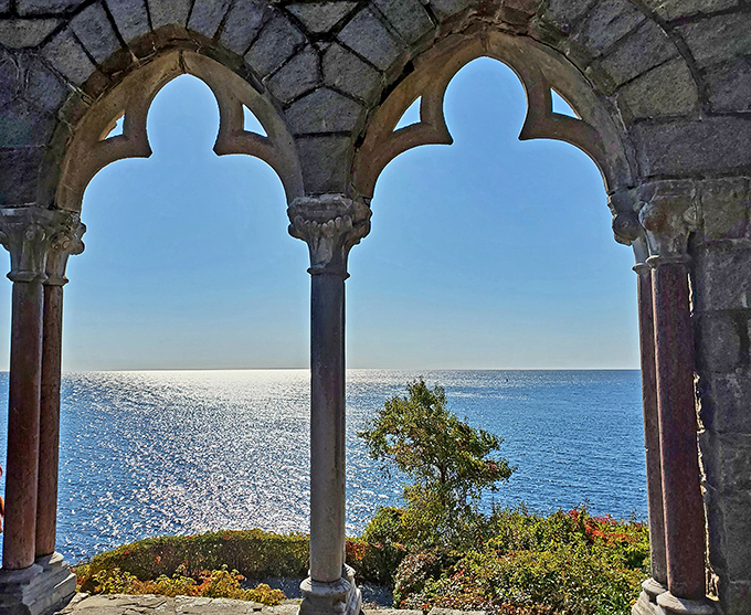 Gothic arches frame the Atlantic like nature's own masterpiece—proving that sometimes the best view comes with a side of history.