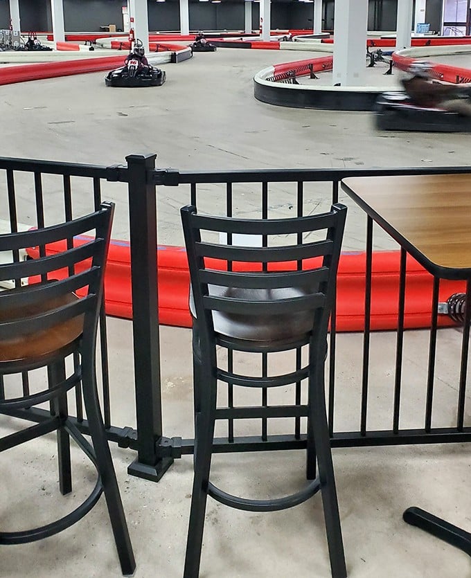 Spectator seats line the track, perfect for sipping a cold one while watching friends pretend they're the next Lewis Hamilton.