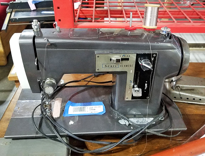 A vintage Sears Kenmore sewing machine sits ready for its second act, proving they really don't make them like this anymore.