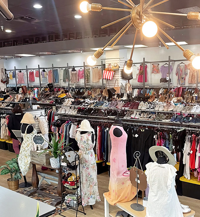 Under the starburst chandelier, a universe of fashion possibilities unfolds&mdash;shoes, dresses, and accessories arranged with boutique precision.