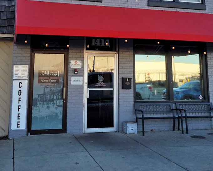 Barbecue and Bourbon's brick building with teal shutters looks like it was plucked from a BBQ fairytale. The sign promises smoky treasures!