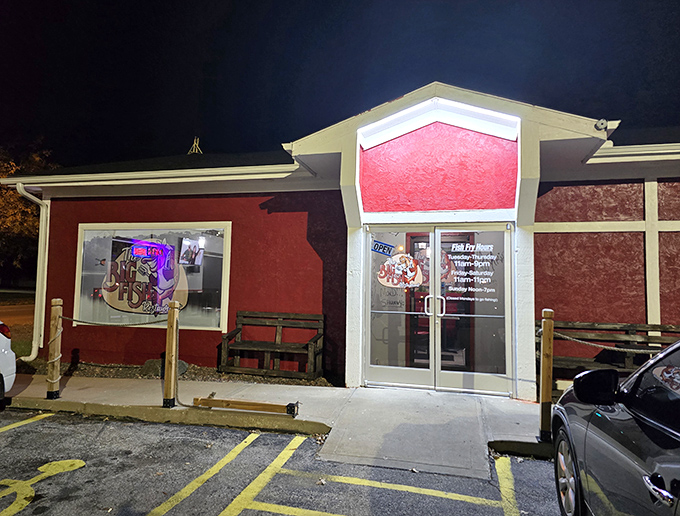 Big Fish Bar and Grill's nighttime glow beckons hungry travelers like a lighthouse for landlocked seafood lovers. Red exterior, golden treasures inside!