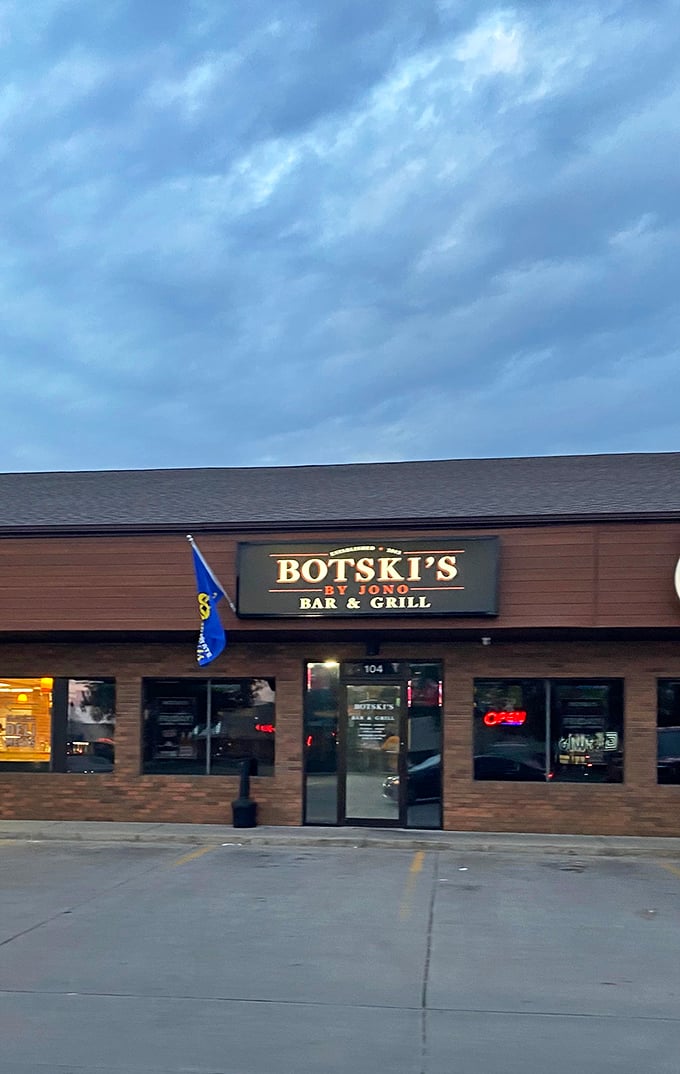 Botski's understated exterior hides a sports bar with serious chicken game. That South Dakota flag signals local pride in every bite.
