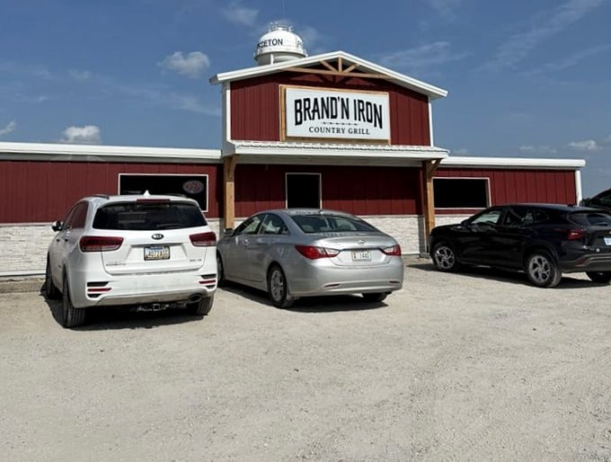 Brand N Iron's barn-red exterior stands proudly against the Kansas sky. When your restaurant looks like a barn, you know the beef is fresh!