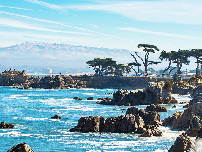 Carmel's rugged coastline puts on a daily show where waves crash against ancient rocks in nature's timeless dance.