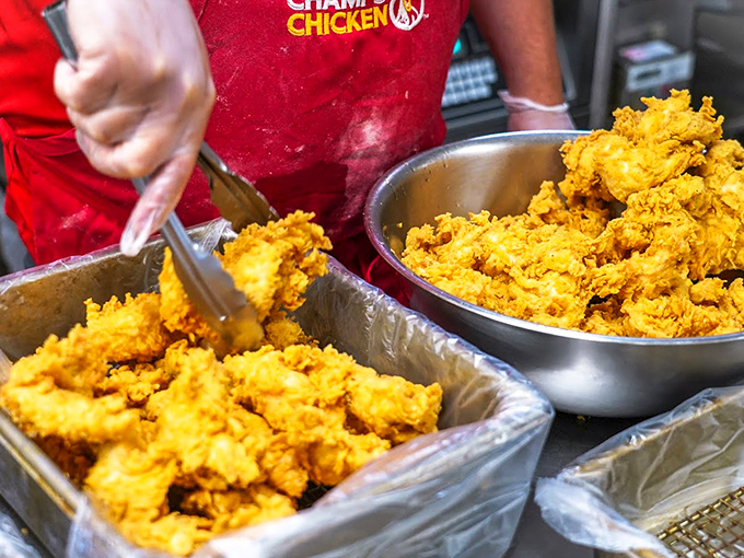 Golden treasures await! Fresh chicken getting the Champs treatment before meeting its crispy destiny.