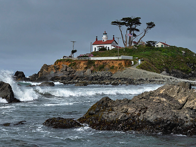 Battery Point Lighthouse perches dramatically on Crescent City's rocky shore, where affordable coastal living meets wild Pacific beauty.