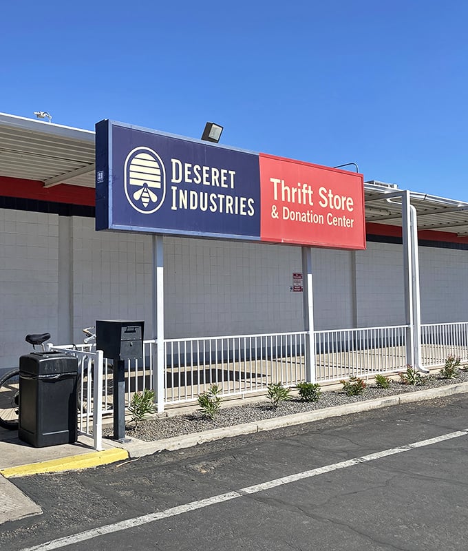 Deseret Industries' bold red and blue sign stands out like a bargain in a sea of retail prices.