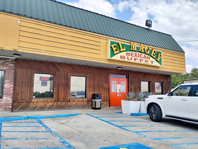 That bright orange door is your portal to a world of authentic Mexican flavors that keep the parking lot full.