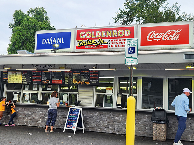 Goldenrod's vintage sign beckons like an old friend. This drive-in sanctuary keeps the flame of classic American fast food burning bright.