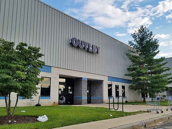 The unassuming "OUTLET" sign understates the adventure within&mdash;a retail wilderness where only the savvy survive and thrive.