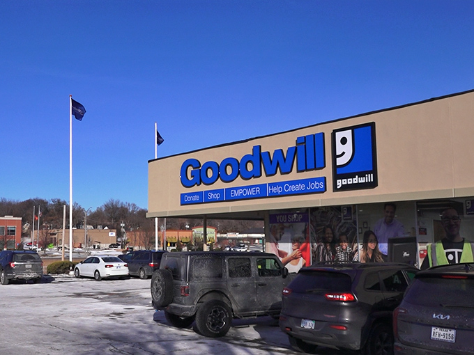 The iconic blue Goodwill sign stands tall against the Kansas sky. This community cornerstone offers treasures for every budget.