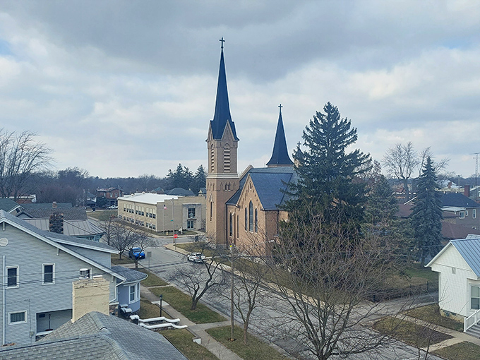 In Greenville, church spires reach toward the sky like quiet prayers, overlooking neighborhoods where faith and community remain deeply valued.