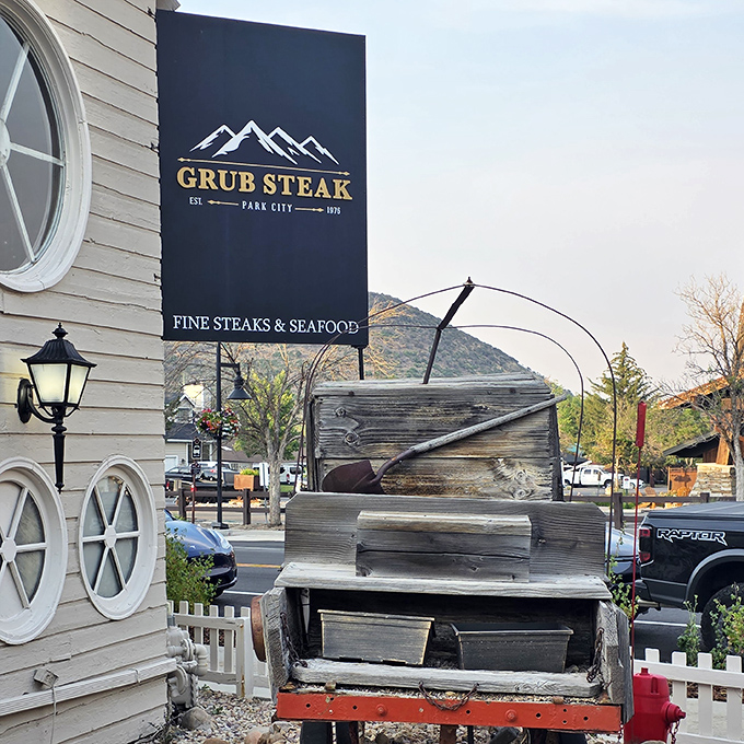 Mountain town simplicity where locals know the real treasure lies beyond that humble wooden exterior.