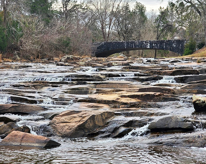 Indian Springs' historic waterfall creates a peaceful soundtrack for visitors. These mineral-rich waters have drawn people for centuries.