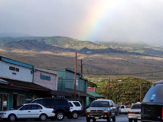 Small-town storefronts beneath a rainbow&mdash;Hawaii's way of saying you've made the right choice. Where even the weather celebrates your decision to slow down.