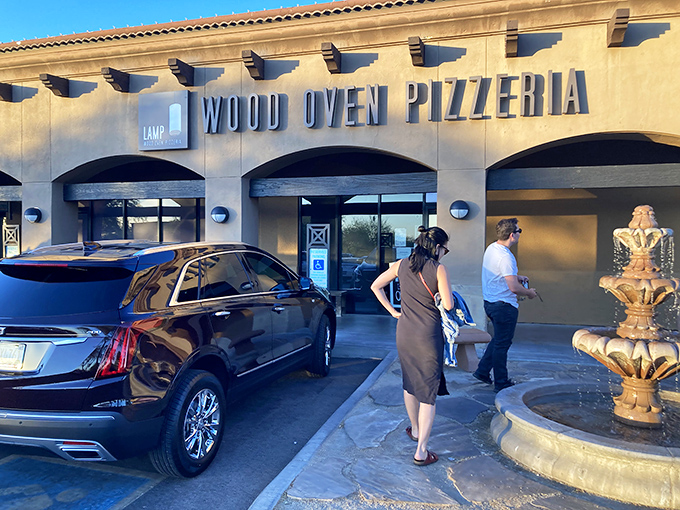 Lamp's sleek exterior houses pizza artistry within. Where industrial meets Italian in Scottsdale's upscale pizza scene.