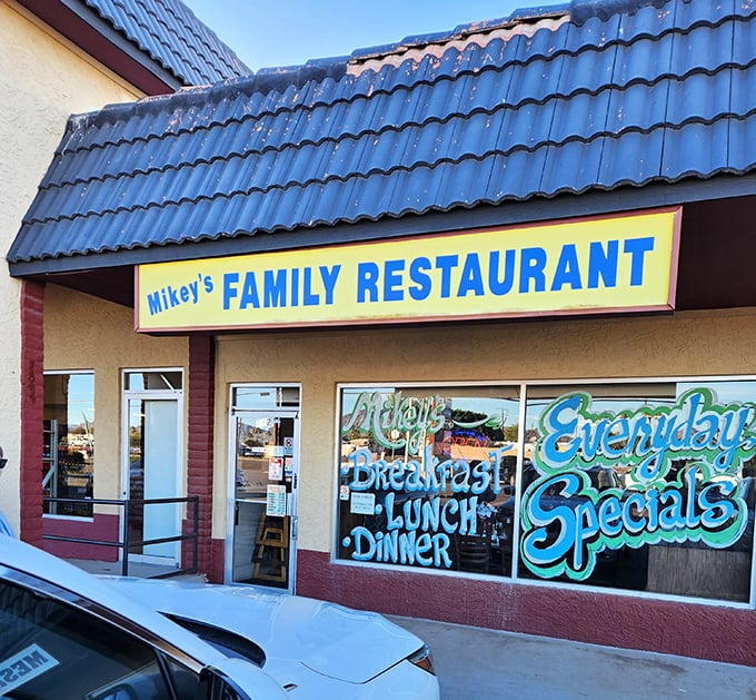 Mikey's colorful window art promises three essential food groups: Breakfast, Lunch, and Dinner – all served with flair.